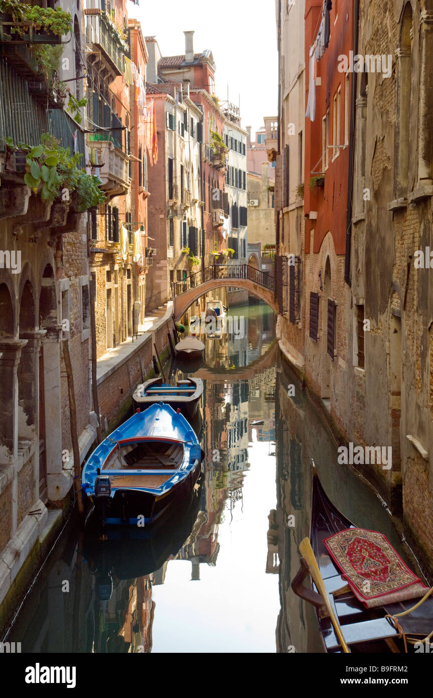 Picturesque small canals in Venice with boats and small bridges Stock ...