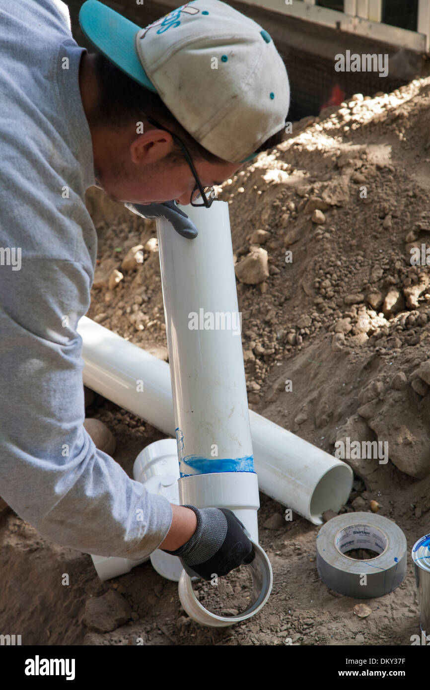 Poly Vinyl Chloride (PVC) Pipes being installed for rainwater Stock ...