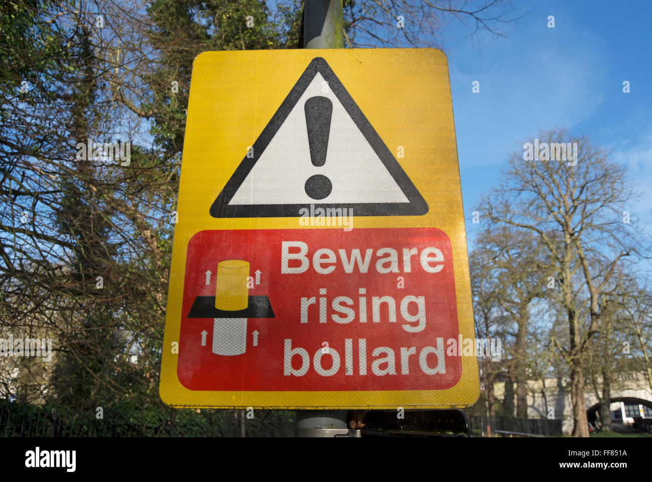beware rising bollard sign, with exclamation mark, in barge walk Stock ...