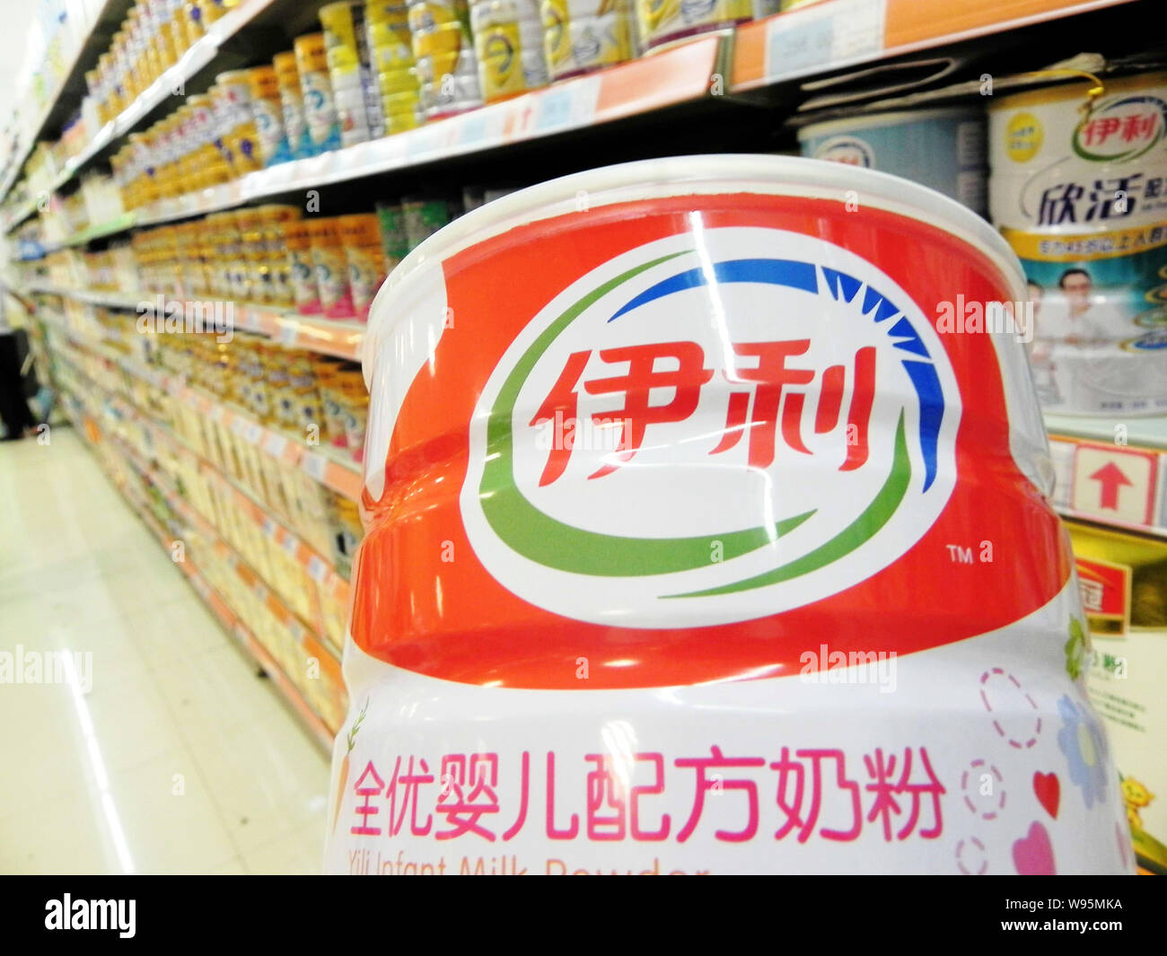 Tins of Yili infant and baby milk powder are for sale at a supermarket ...